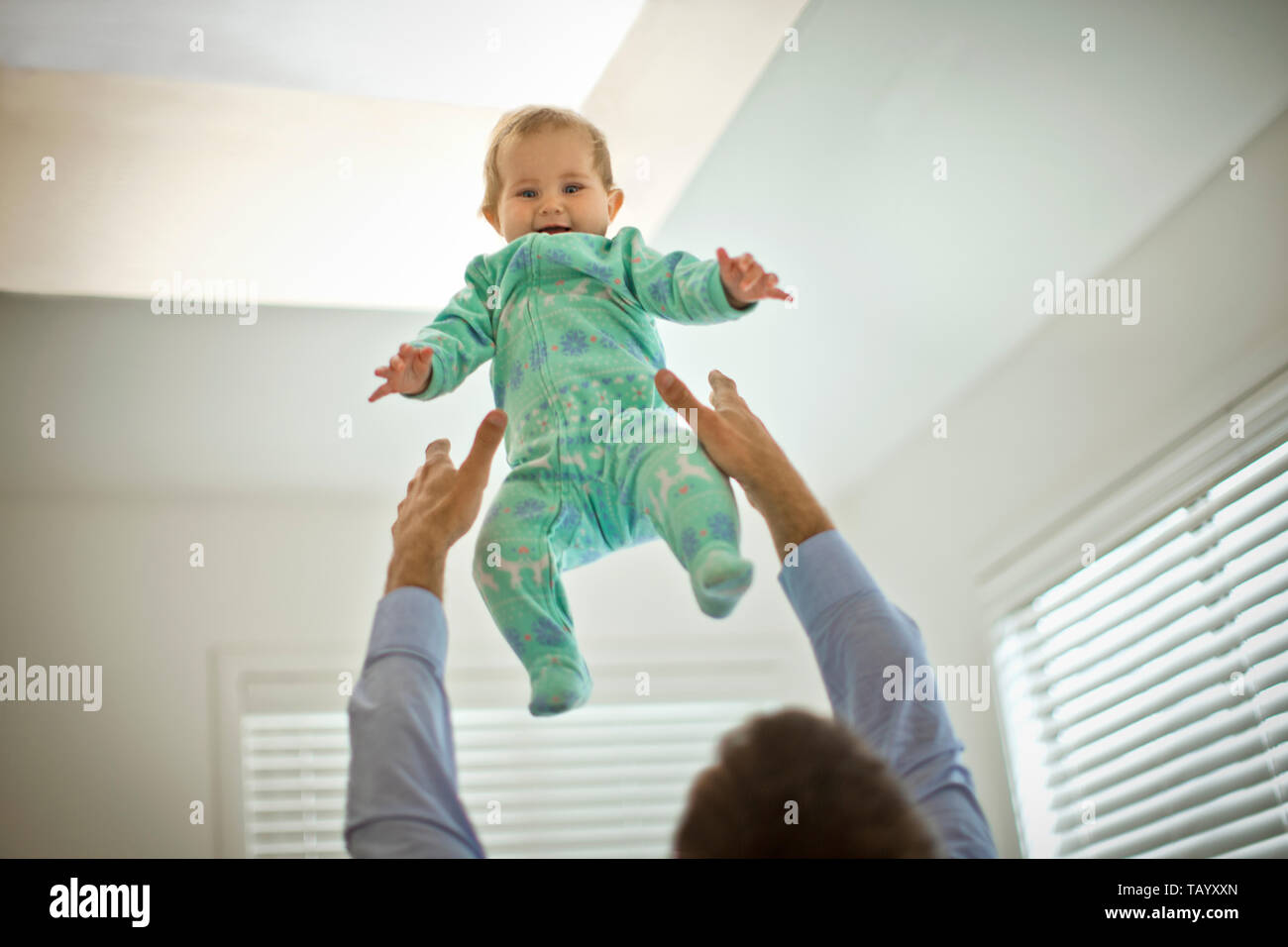 Dad throwing catching baby hi-res stock photography and images - Alamy