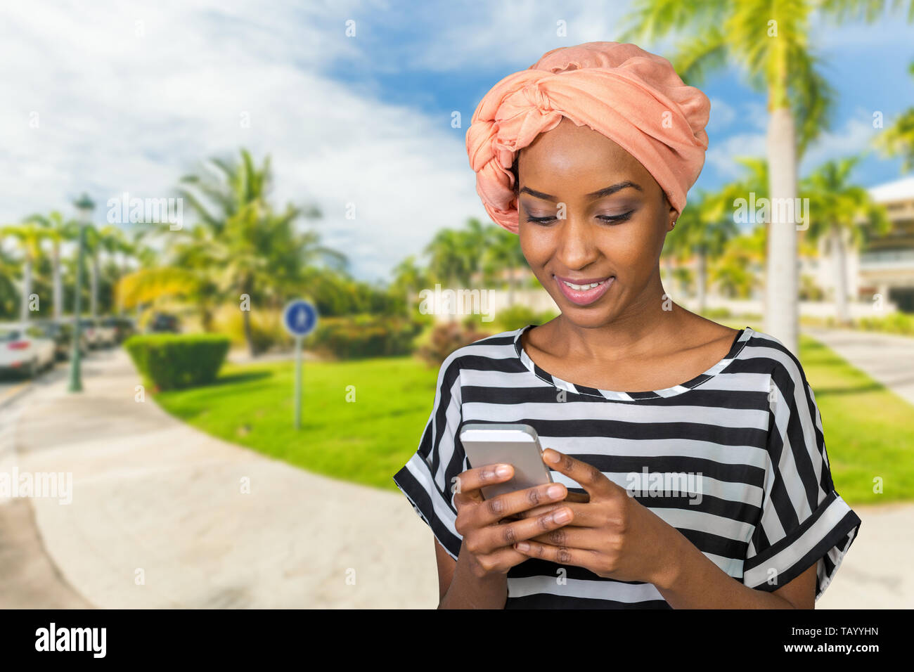 African American Woman with a mobile phone Stock Photo - Alamy
