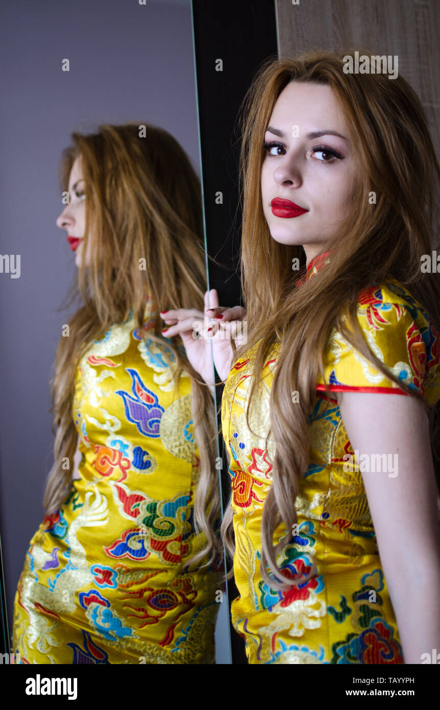 Shapely girl from Poland. Young female model posing near mirror ...