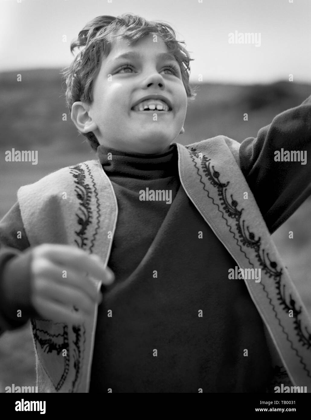 Small boy smiling looking upwards Stock Photo - Alamy