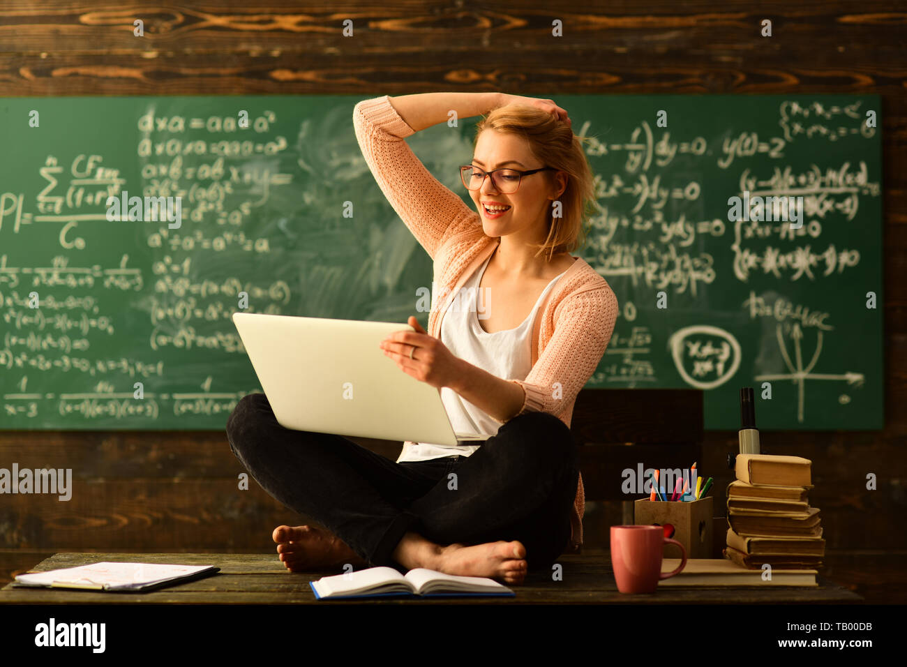 Smiling adult students during break in classroom interior, University ...