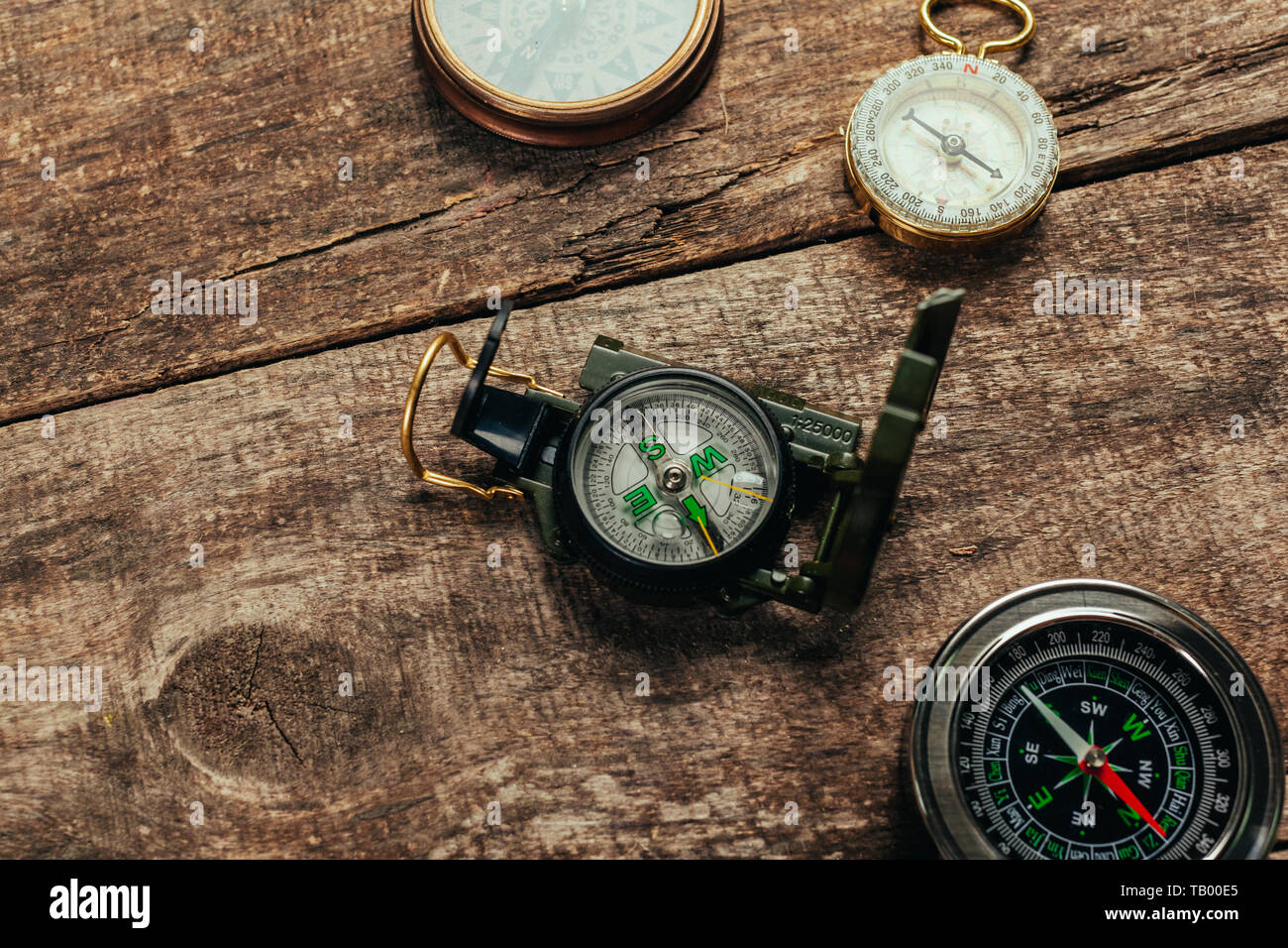 Compass on a wood deck Stock Photo - Alamy