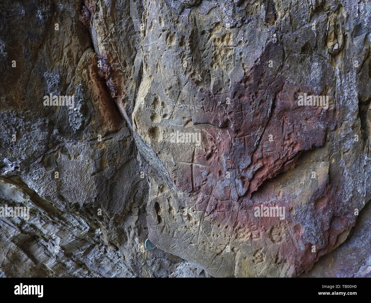 Stone carved crosses and graffiti at Saint Ninian's Cave, a place of ...