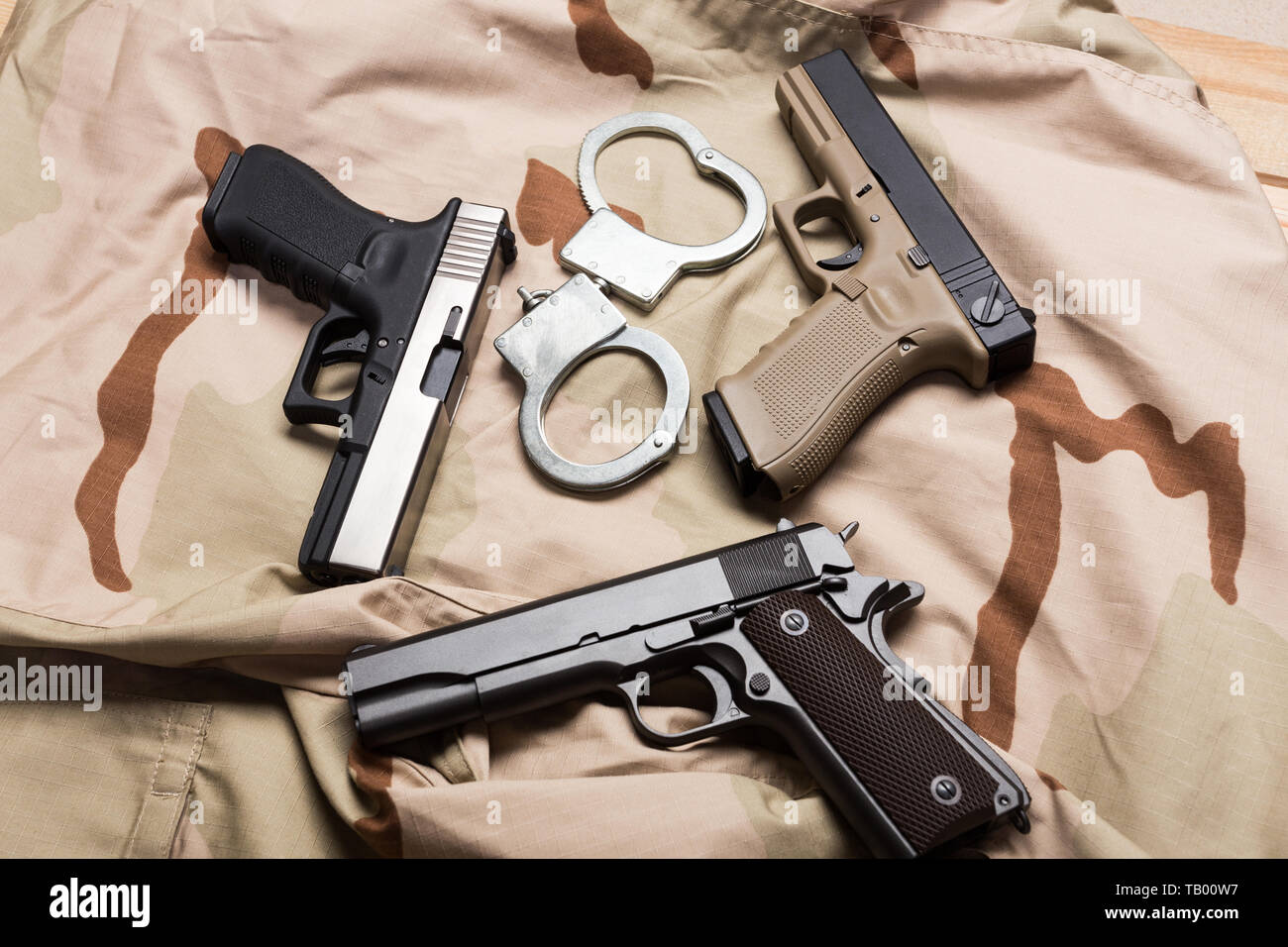 Pile of handguns Stock Photo - Alamy