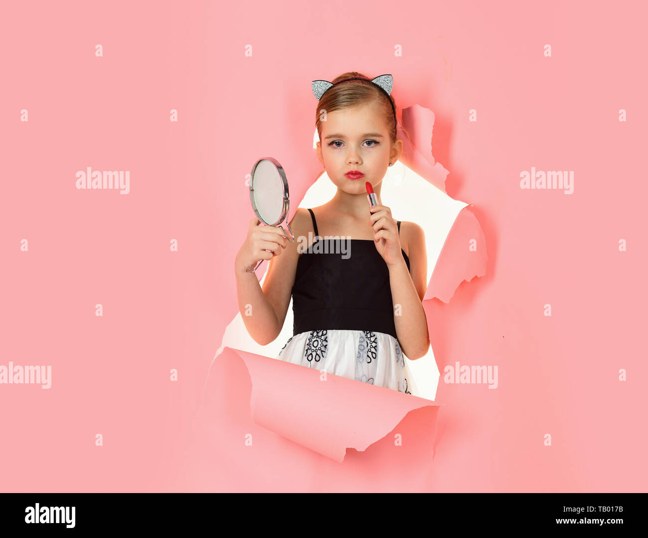 pinup style of little girl. pinup girl with mirror and red lipstick ...