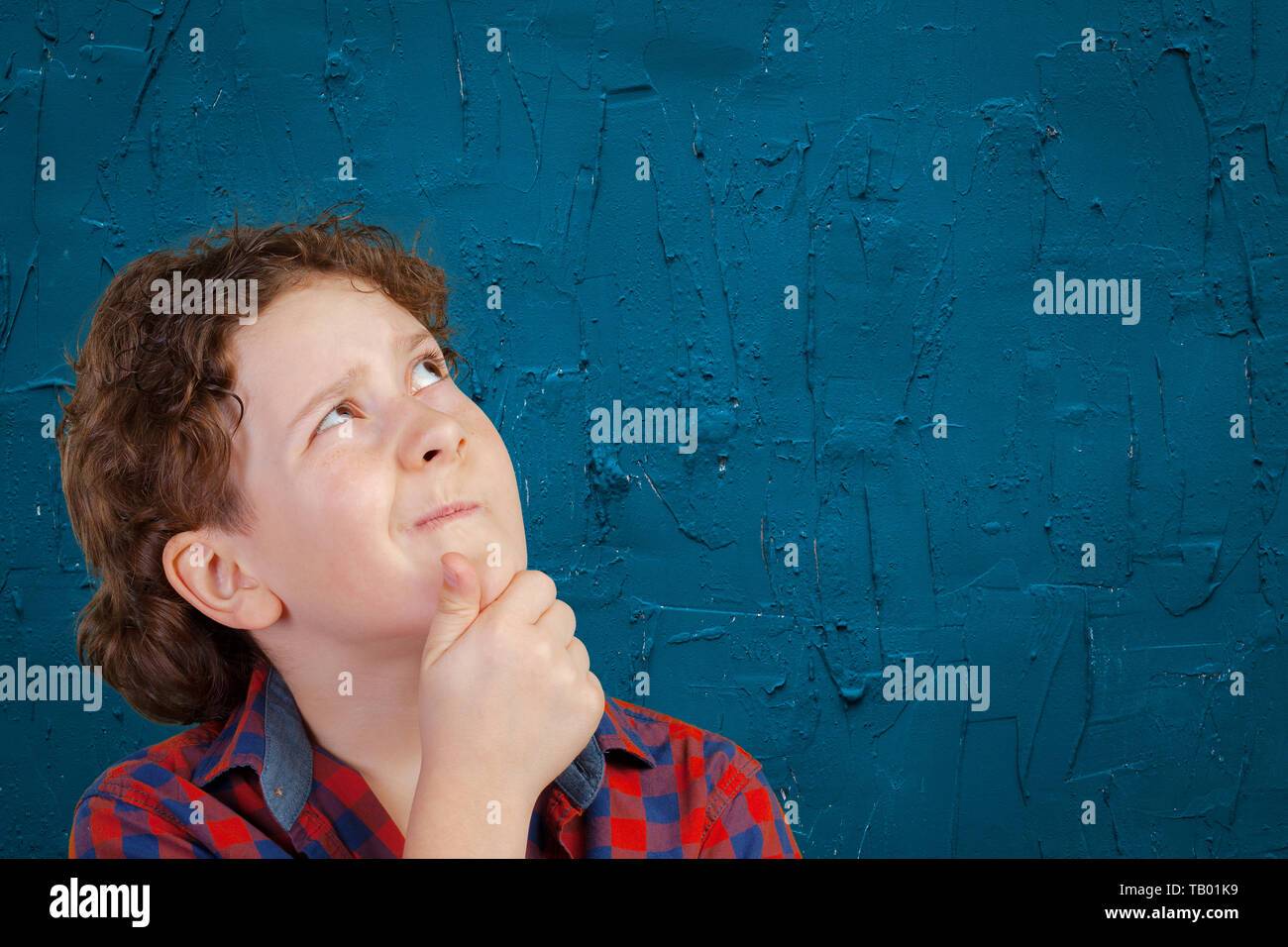 cute young boy thinking Stock Photo - Alamy