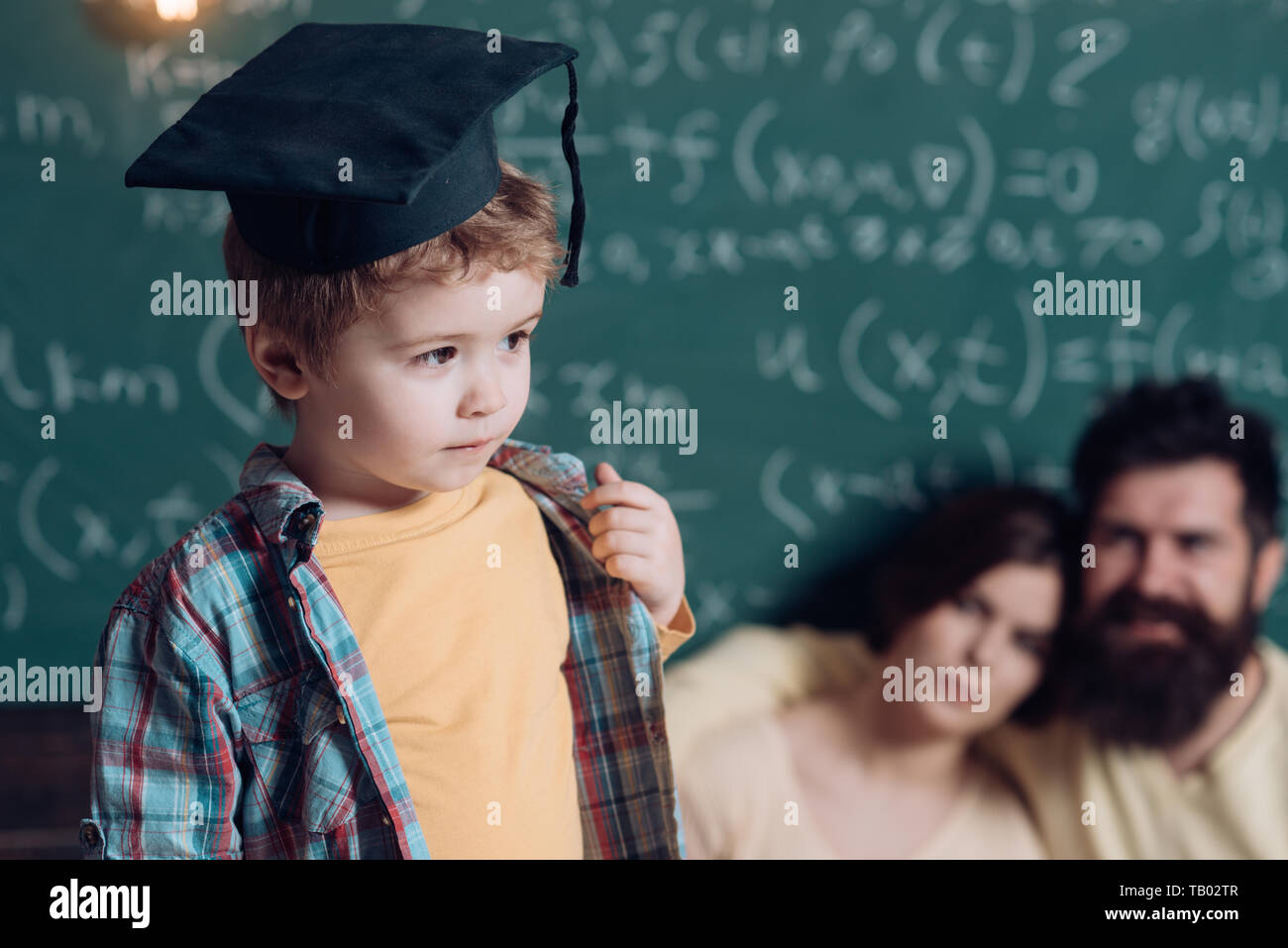 Child and childhood. Little child in graduation cap. Child in classroom ...