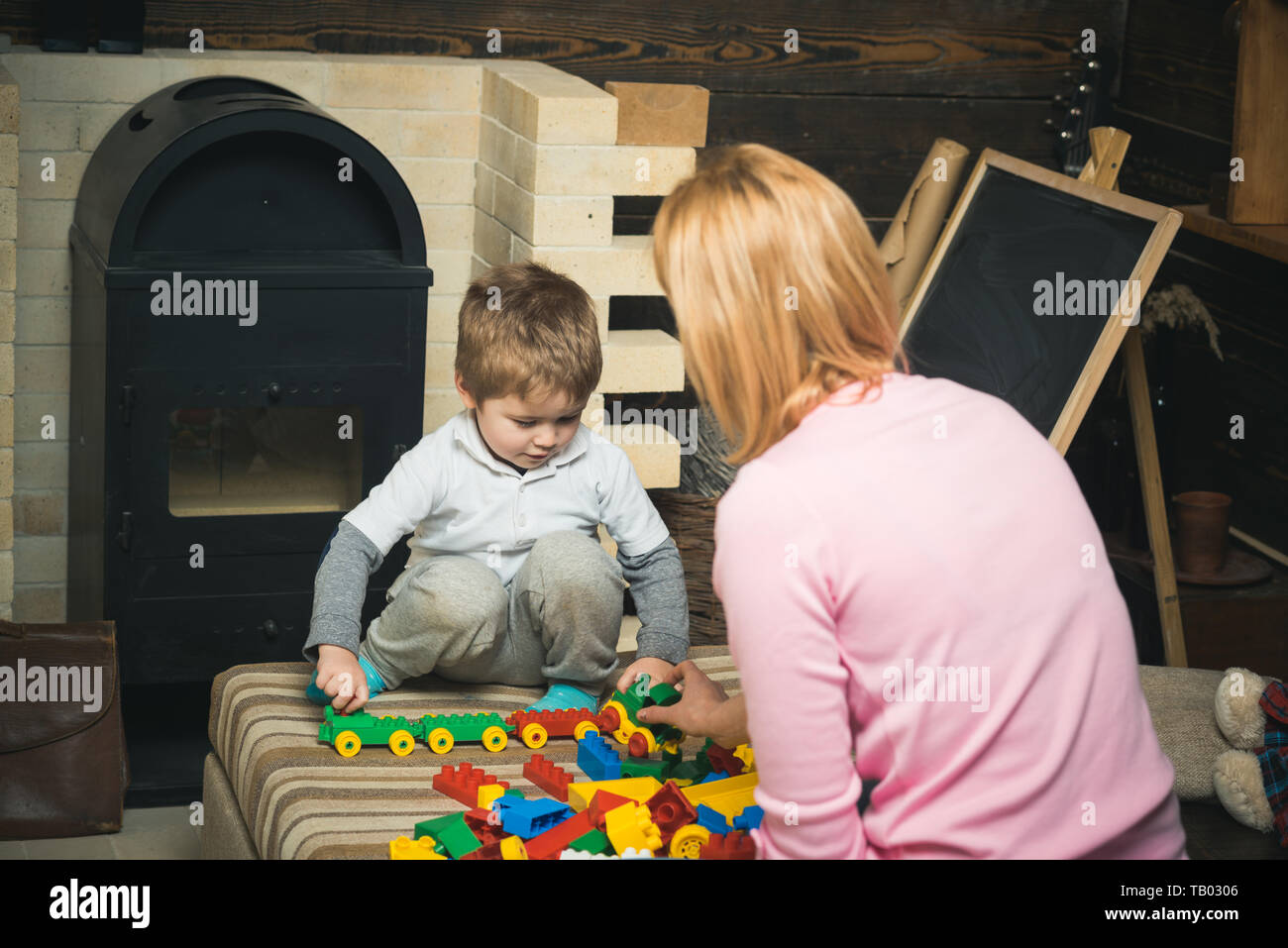 Team concept. Team play. Family team build structure with toy bricks ... Team concept. Team play. Family team build structure with toy bricks ...