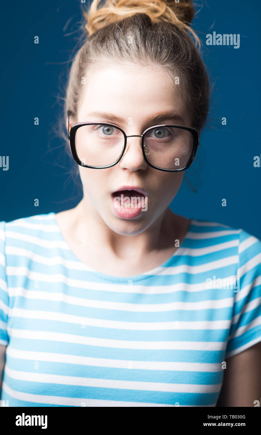 visual improvement. visual improvement of surprised teen girl in ...