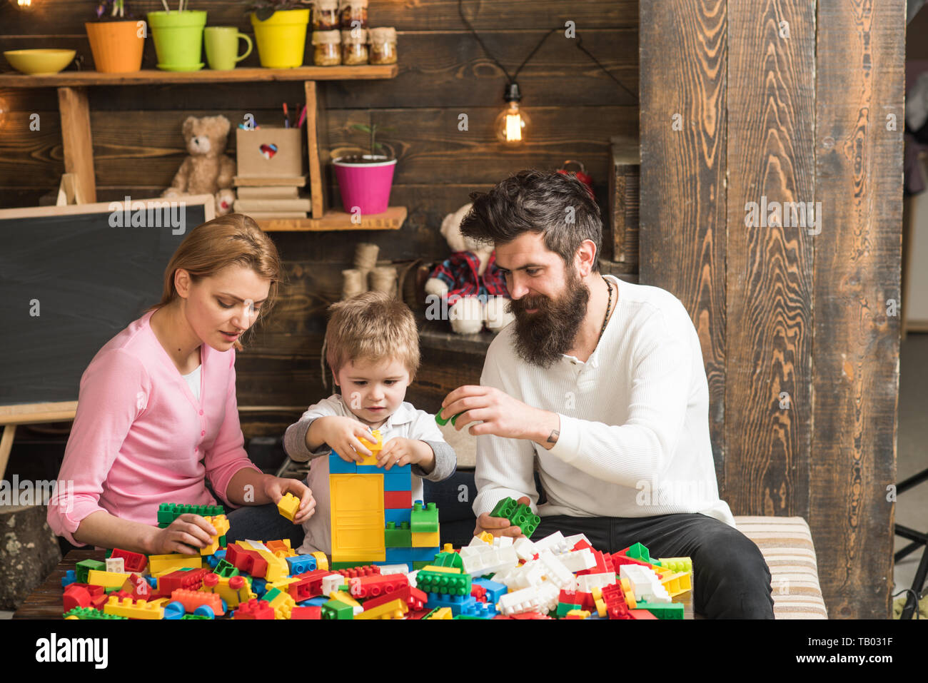 Family concept. Family play with colorful bricks. Family build ...
