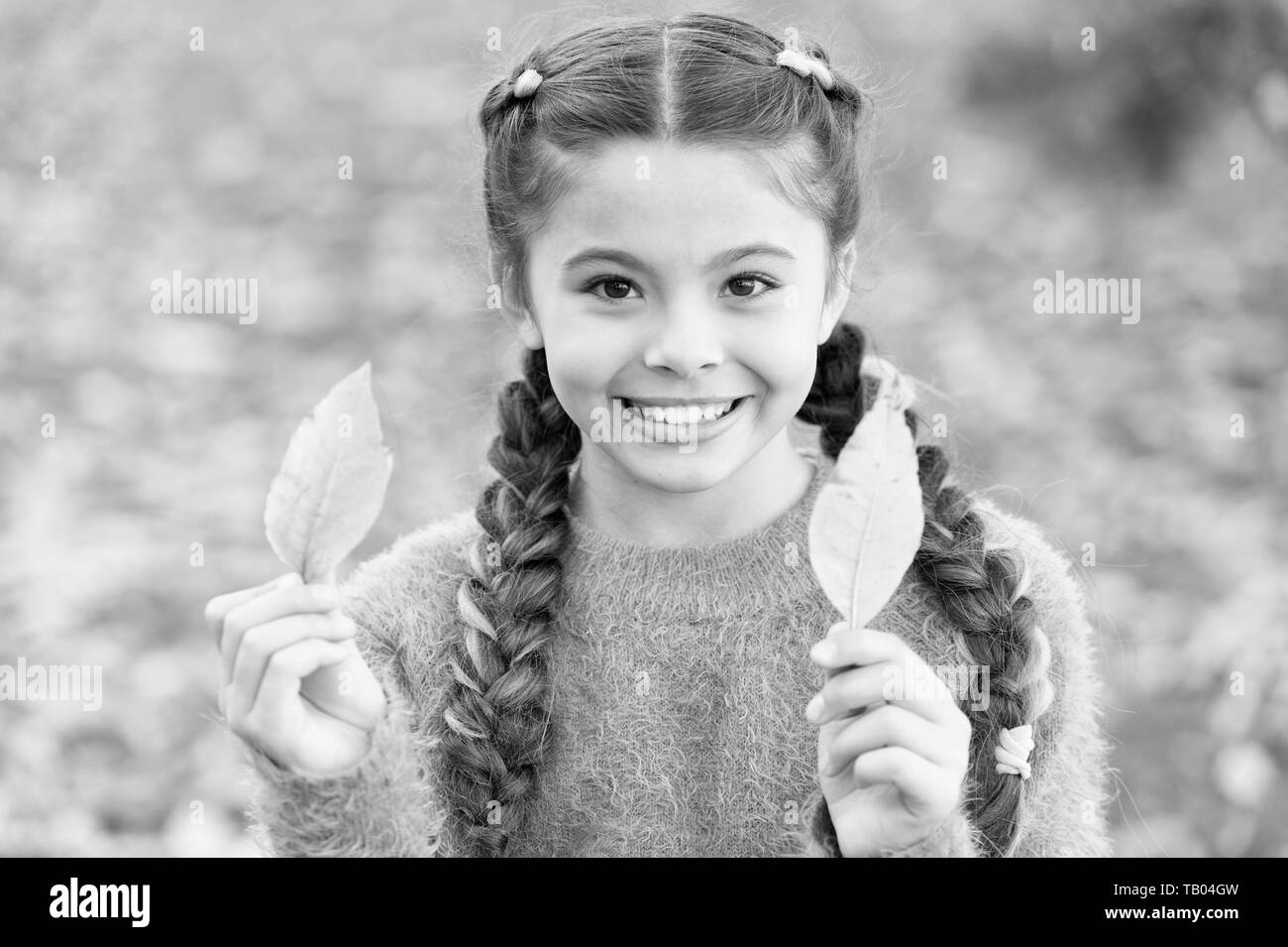 Small child with autumn leaves. Happy little girl in autumn forest ...