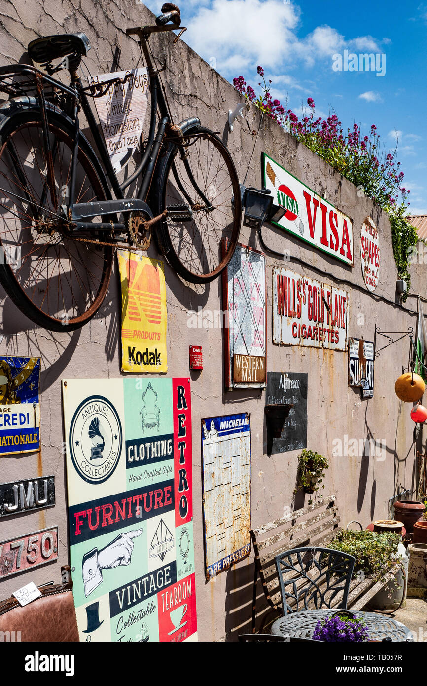 Vintage enamel signs and period bike Stock Photo - Alamy
