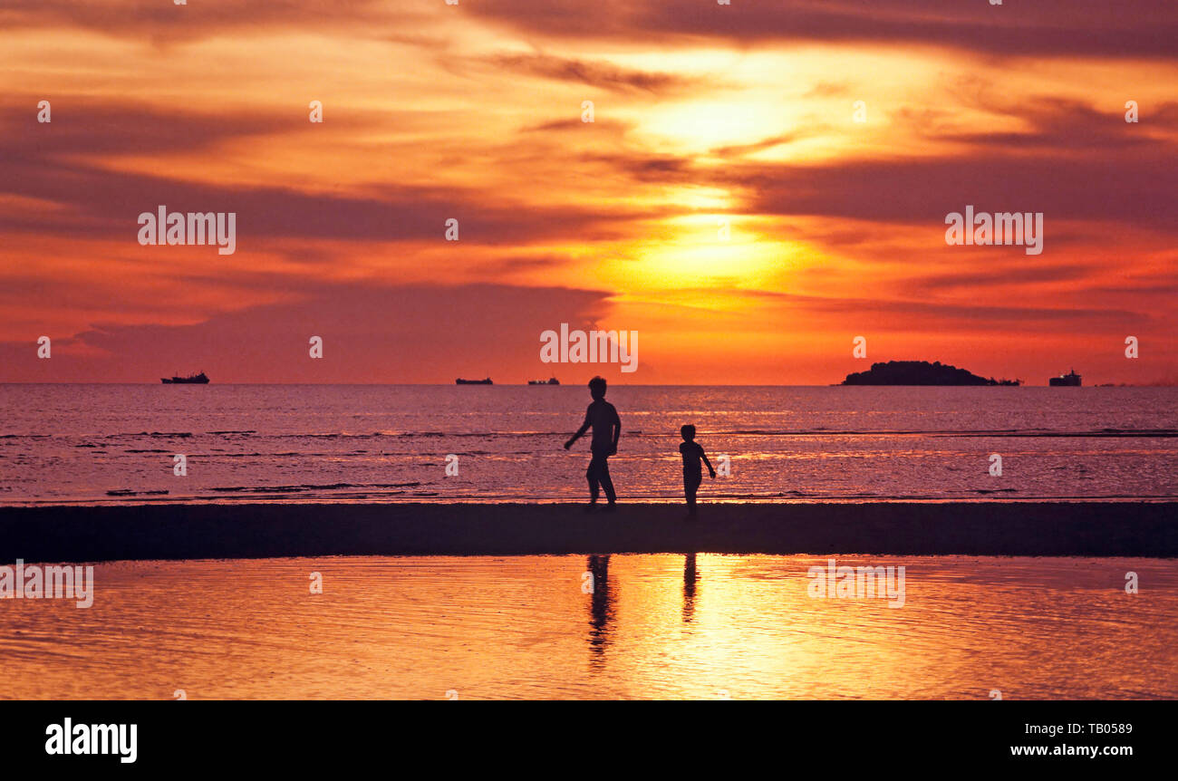 Beach sunset, Port Dickson, Malaysia. Mother and child silhouette Stock ...