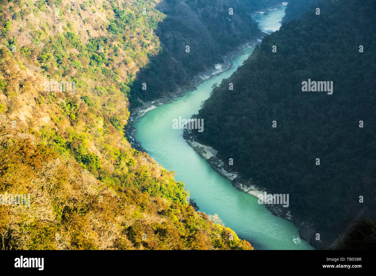 Stunning view of some green mountain peaks with the Sacred Ganges River ...