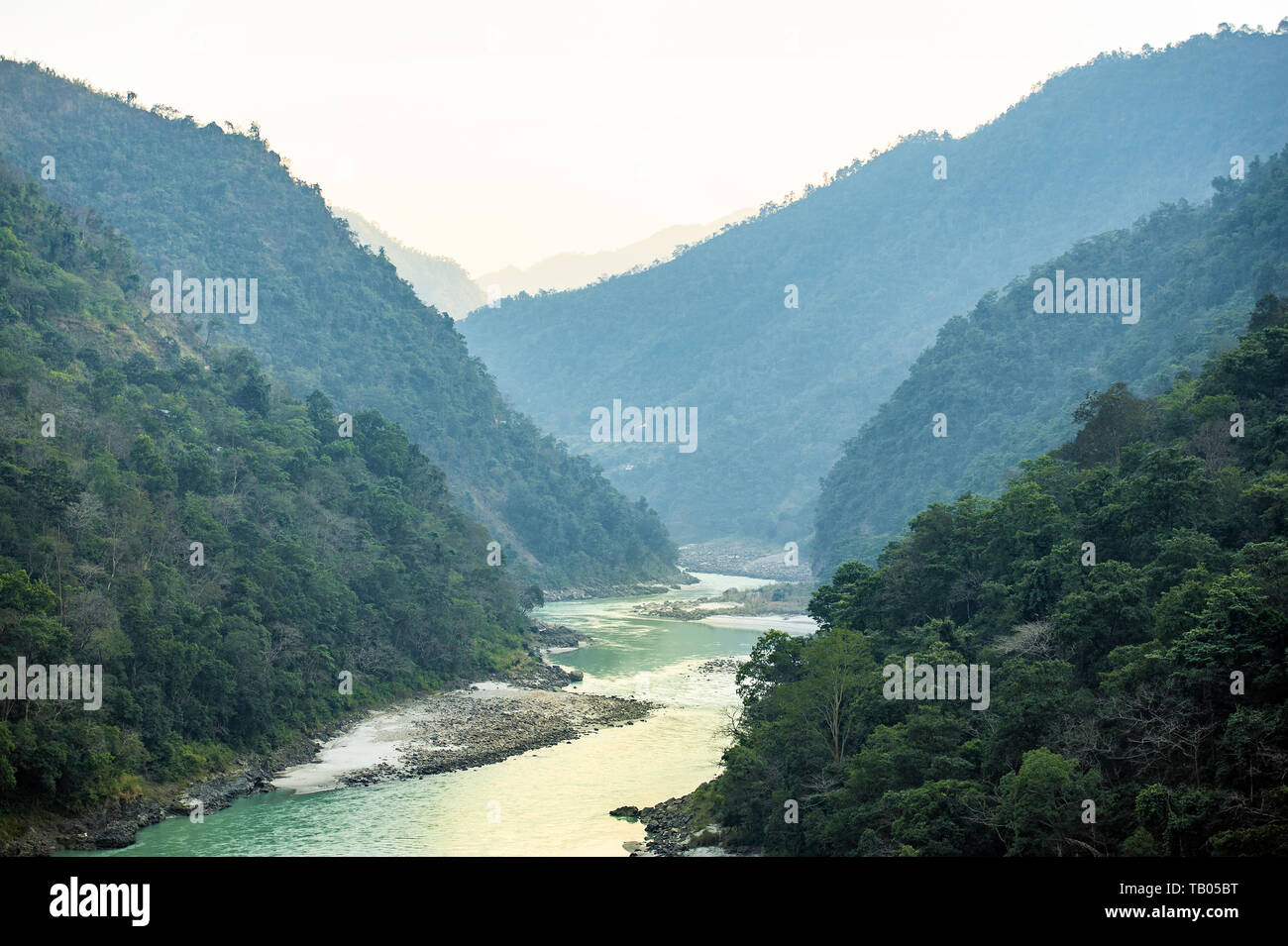 Stunning view of some green mountain peaks with the Sacred Ganges River ...