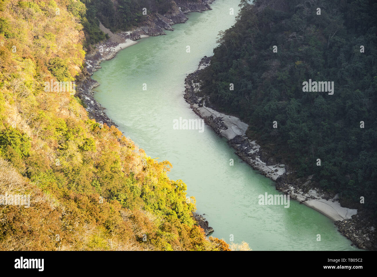 Stunning view of some green mountain peaks with the Sacred Ganges River ...