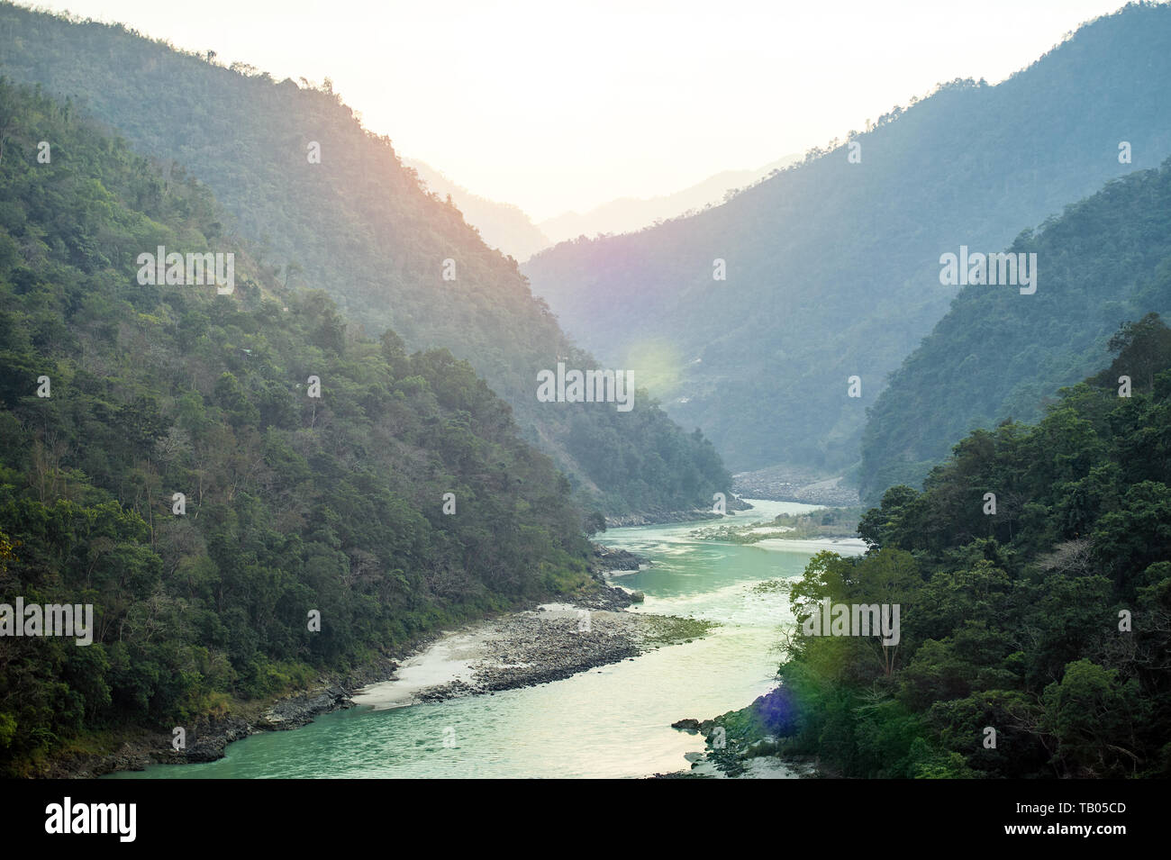 Stunning view of some green mountain peaks with the Sacred Ganges River ...