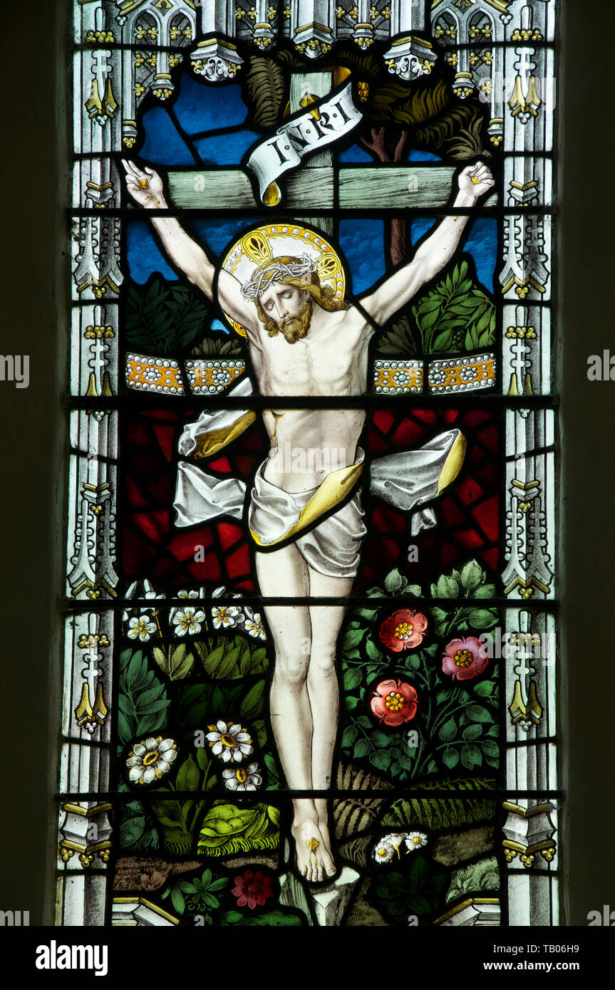 Crucifixion. Jesus Christ crucified on the cross depicted in an old Victorian stained glass ...
