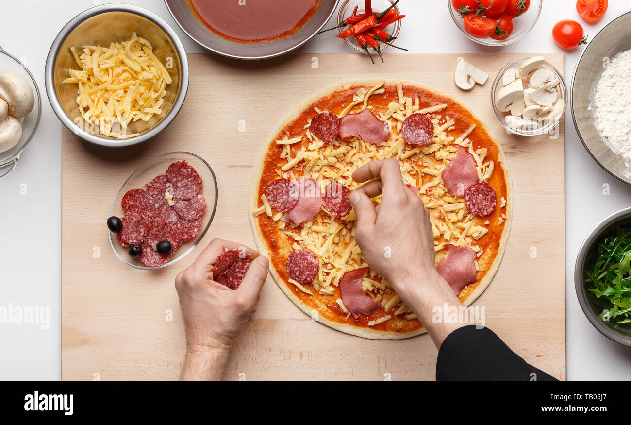 Restaurant kitchen chef decorating pizza hi-res stock photography and ...