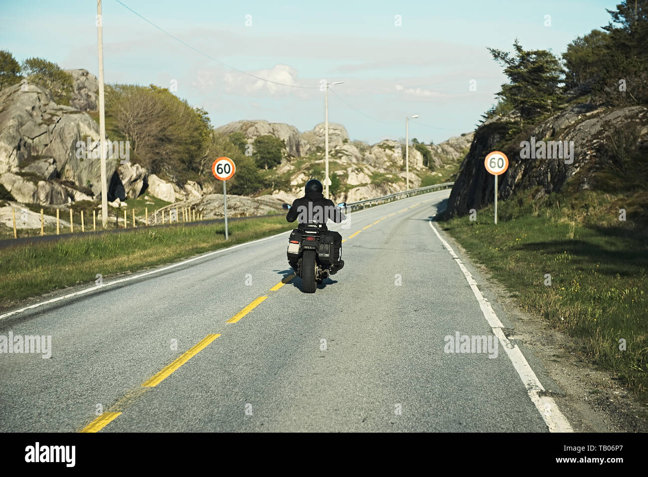 back view of two motorcyclists on mountain road in Norway Stock Photo ...