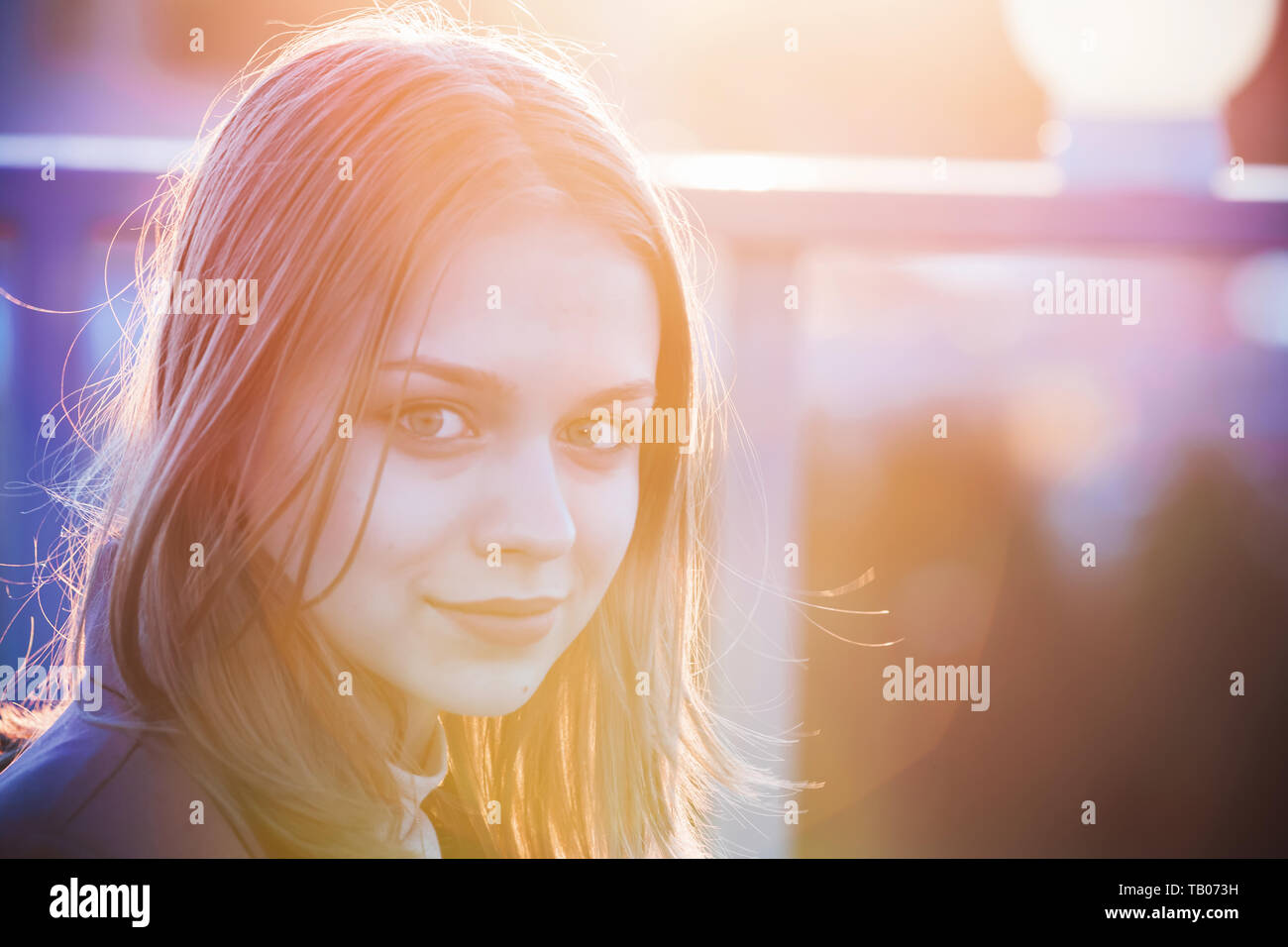 Beautiful smiling teenage girl, close up outdoor portrait with colorful ...