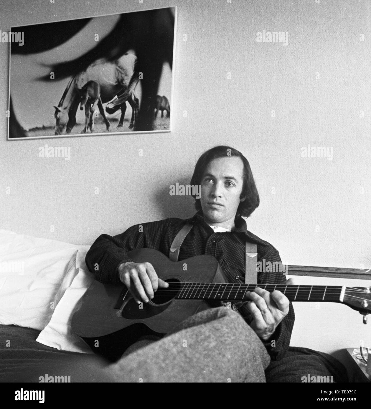 Ry Cooder during an interview plays his guitar, Amsterdam, Netherlands ...