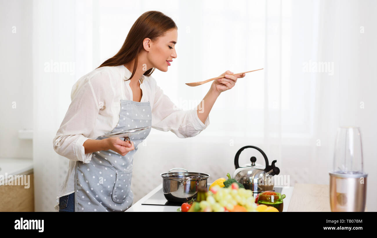 Spoon woman try pot hi-res stock photography and images - Alamy