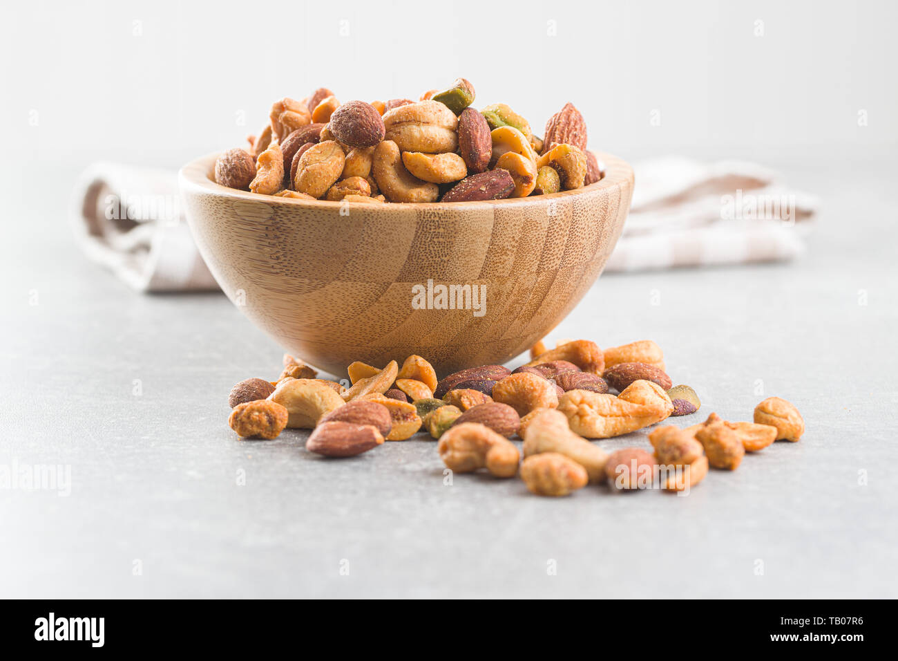 Spicy flavoured nuts. Mix of nuts in bowl Stock Photo - Alamy