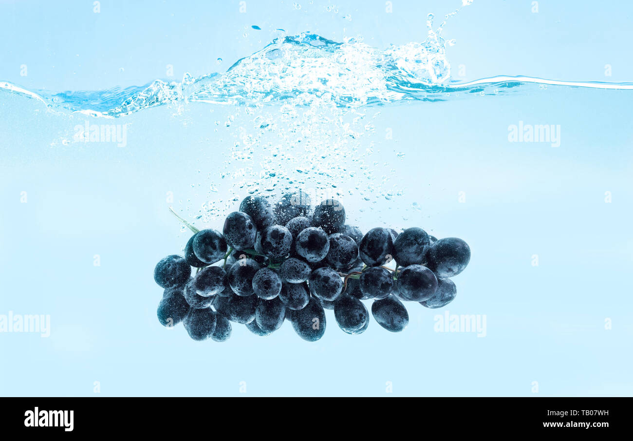 Fruit dropped in water with splash hi-res stock photography and images ...