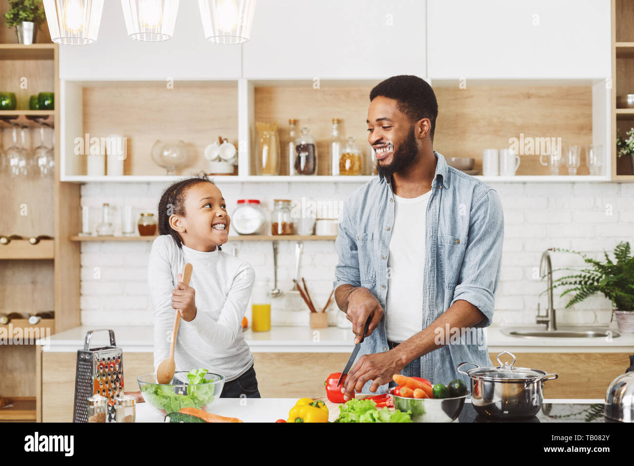 Cooking dinner for mother concept Stock Photo - Alamy