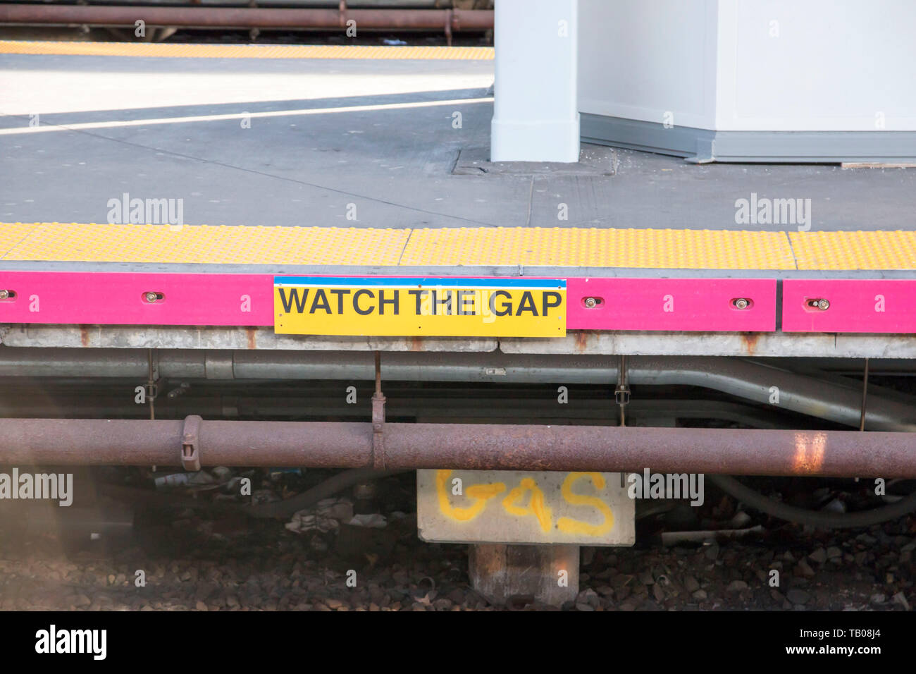 Platform at a long island railroad station has a warning sign which ...