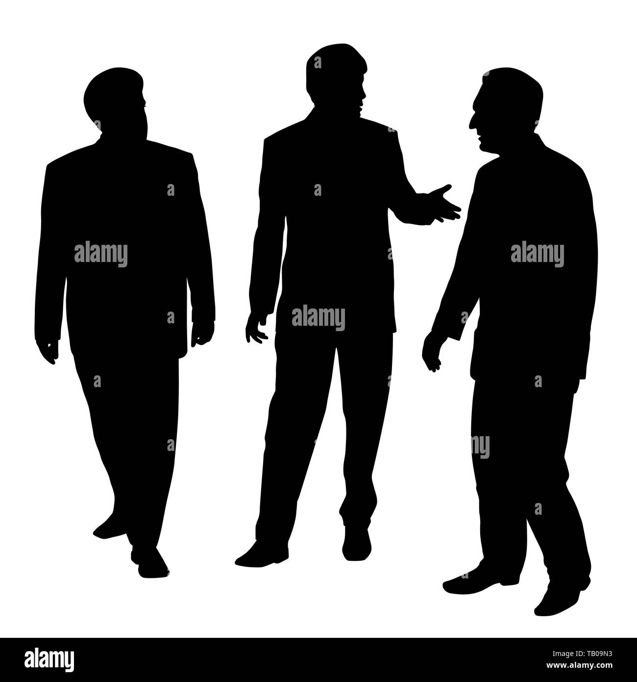 Group of three businessmen walking and talking Stock Photo - Alamy