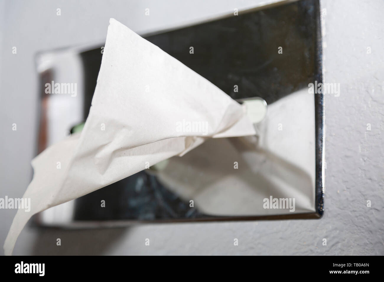 Close up of a tissue dispenser mounted to a wall Stock Photo - Alamy