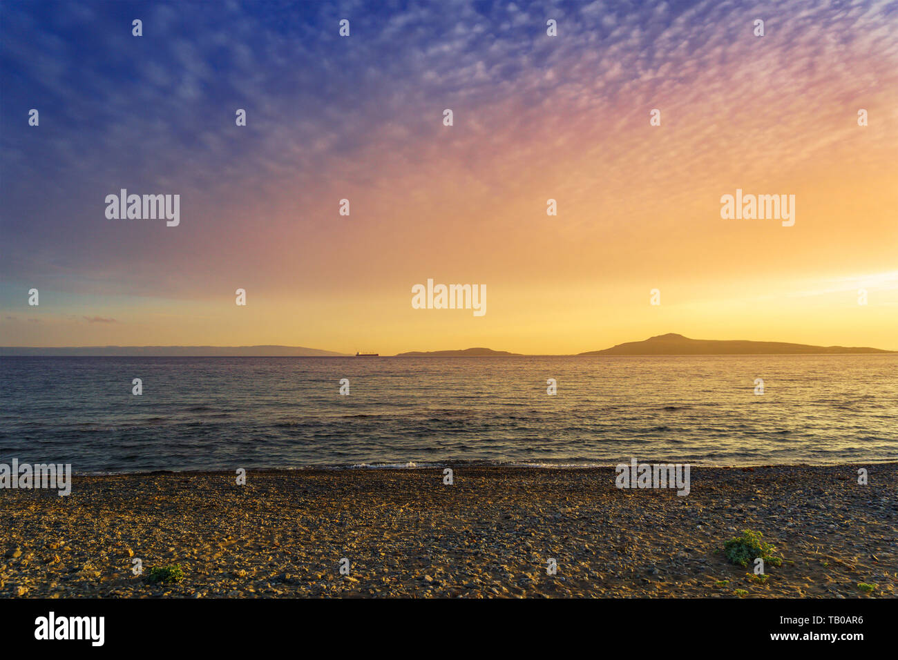 Amazing sunset near Neapolis town, Greece. Rocky seascape scenery with ...
