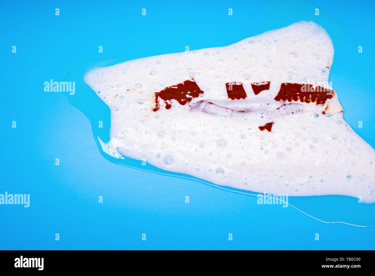 side view melted chocolate flavor popsicle on blue background Stock ...