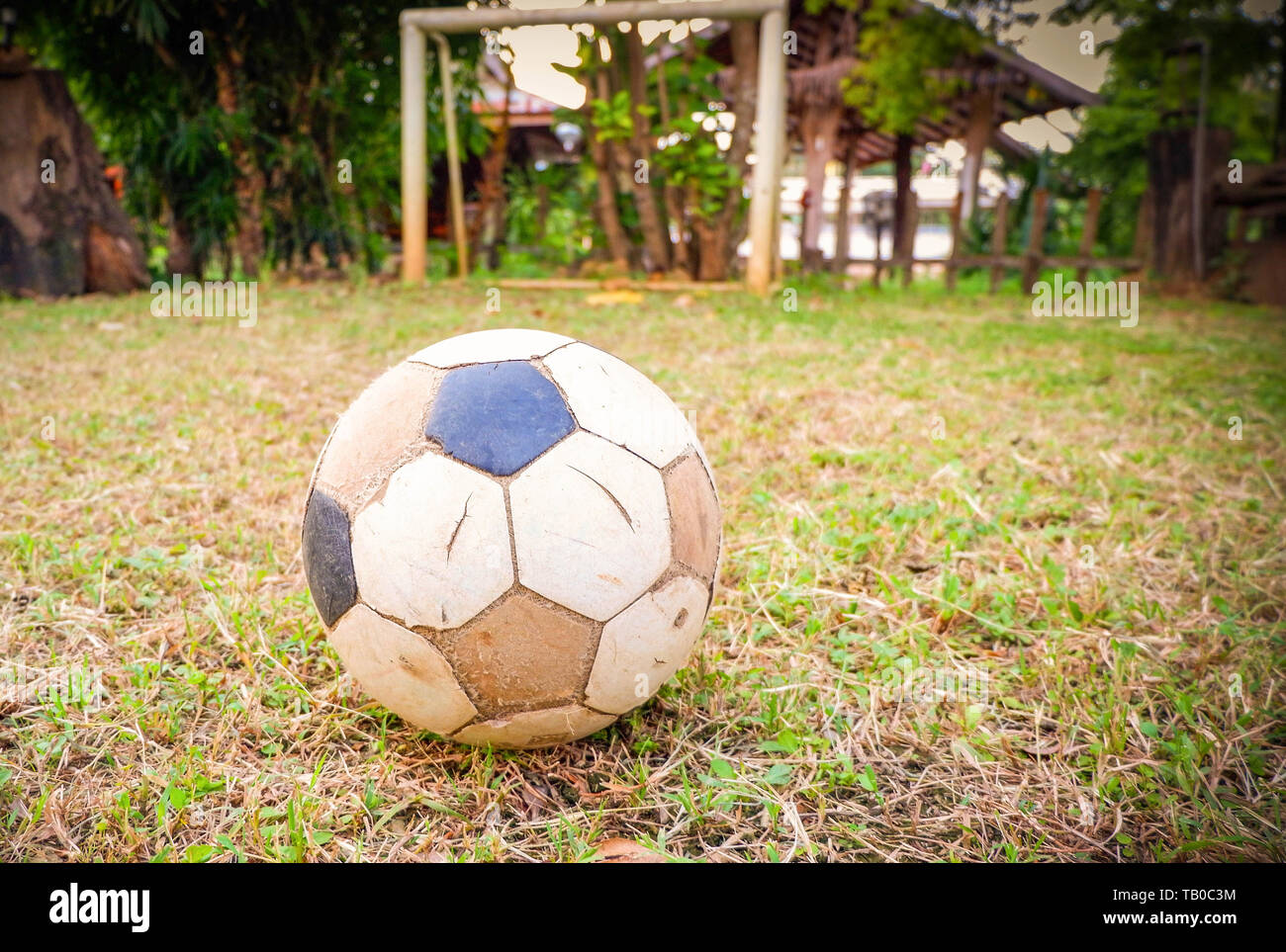 Old soccer ball in rustic football field in the countryside Stock Photo ...