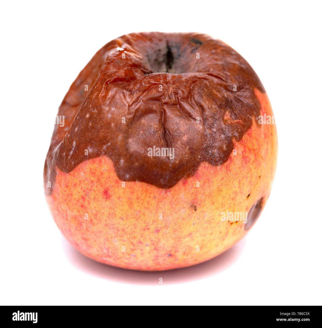 badly rotten apple on a white background Stock Photo - Alamy