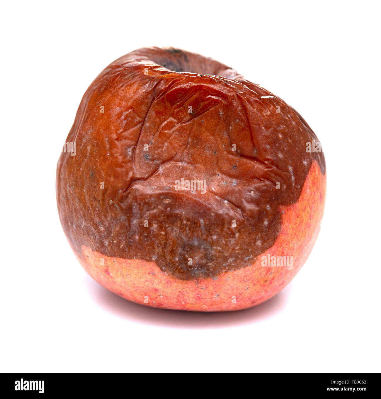 badly rotten apple on a white background Stock Photo - Alamy