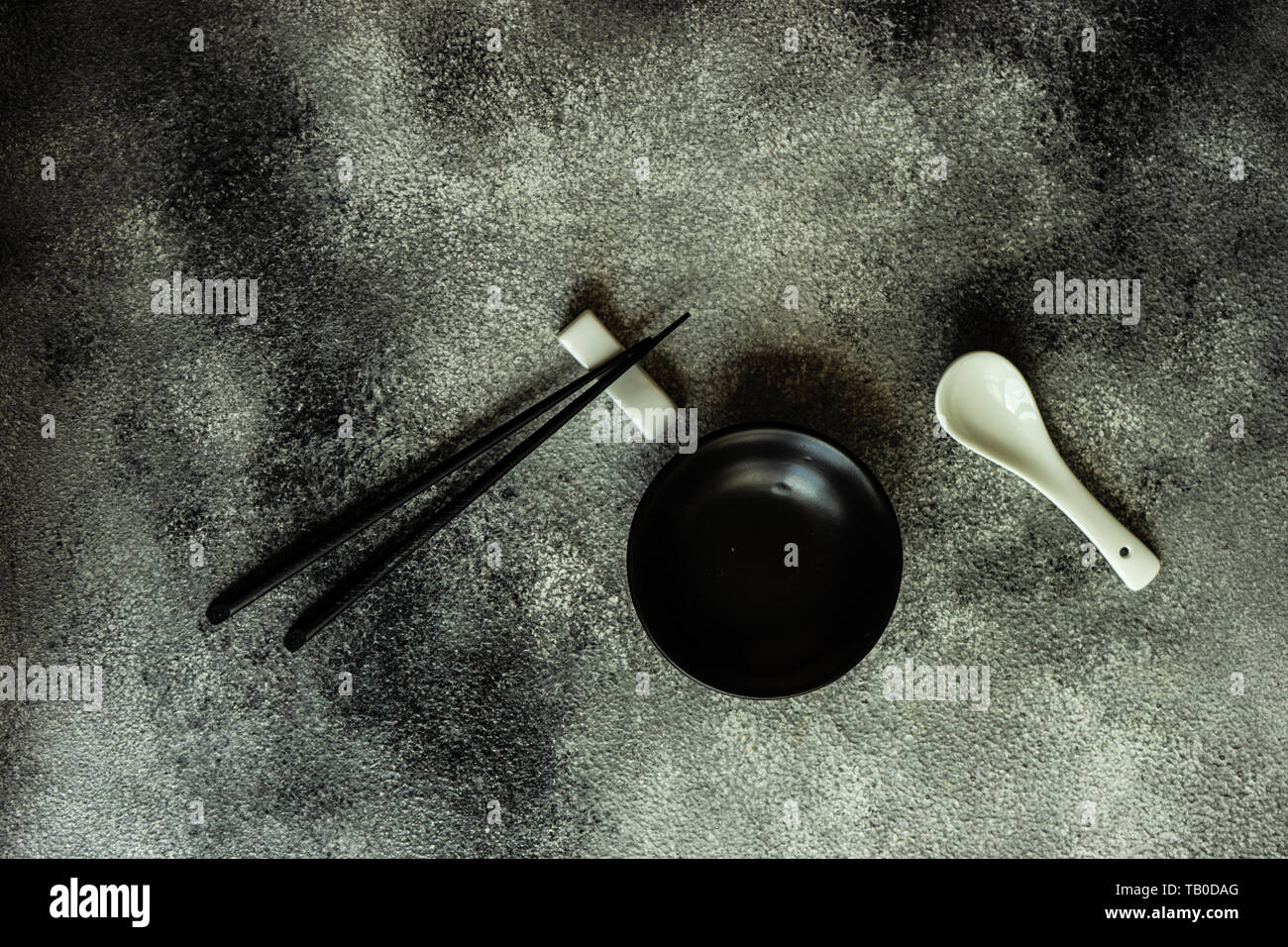 Asian style table setting with chopsticks on grey background with copy ...