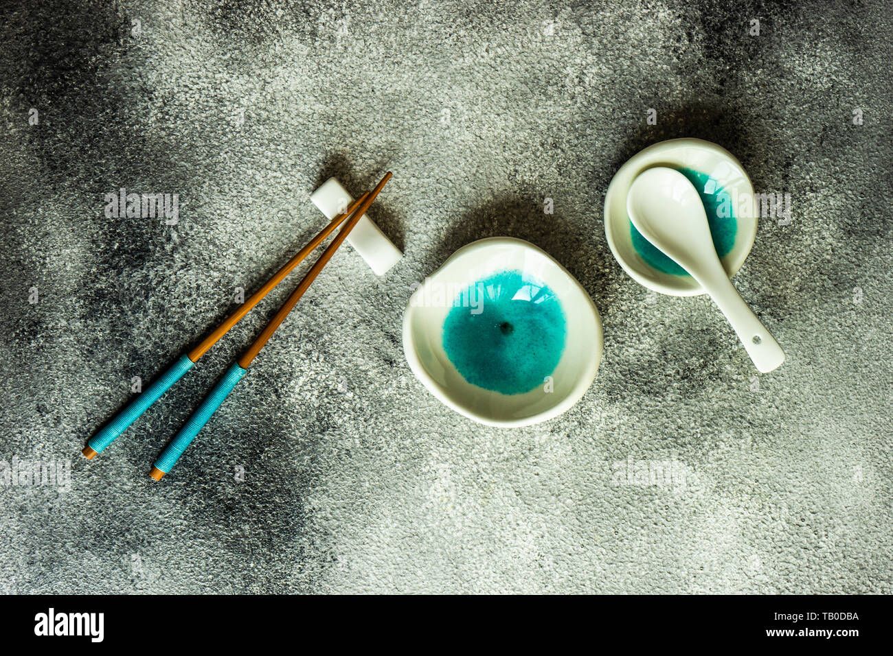 Asian style table setting with chopsticks on grey background with copy ...