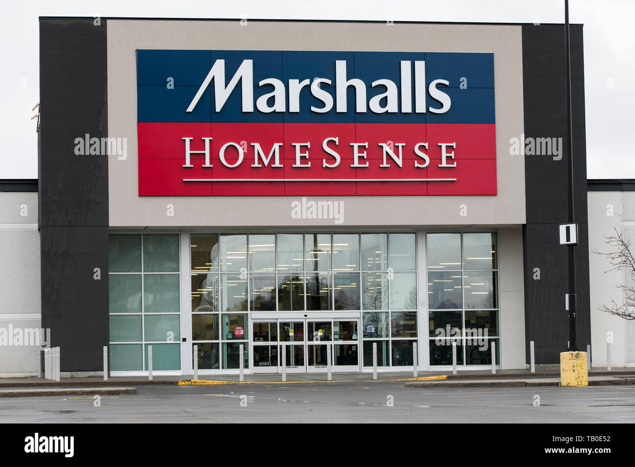 A logo sign outside of a Marshalls and HomeSense retail store location ...