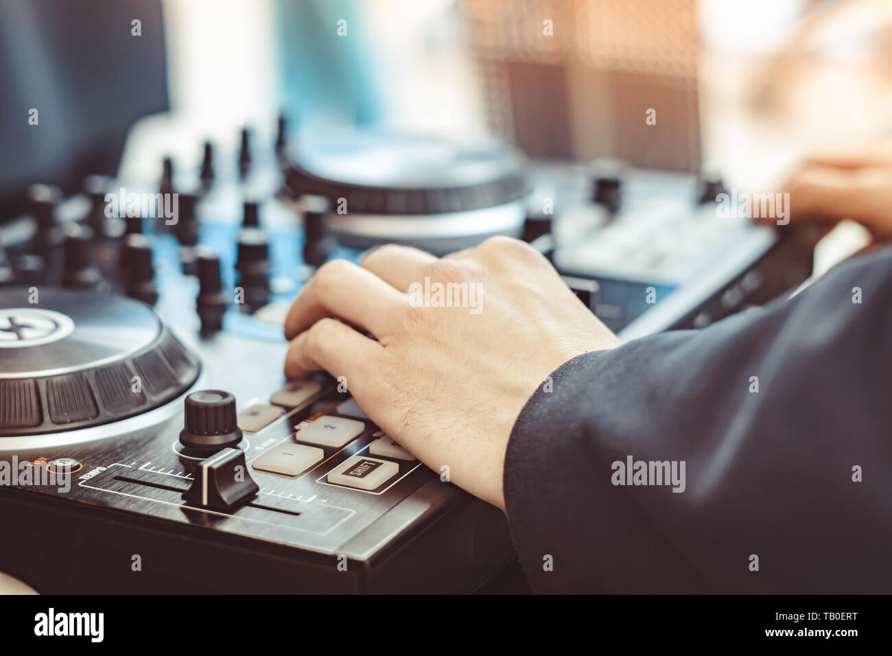 Dj on mixing desk nightclub hi-res stock photography and images - Alamy