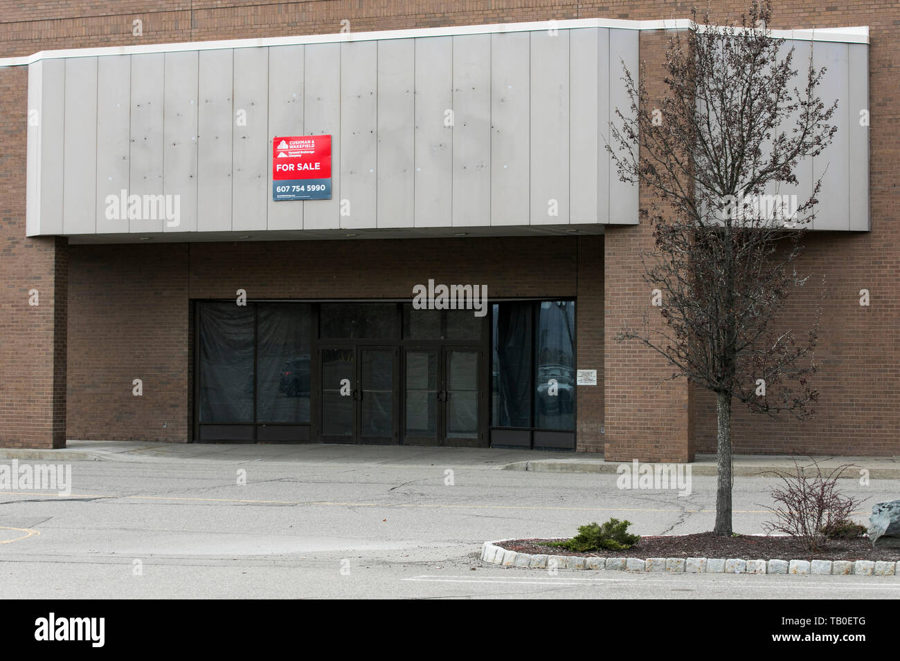 The outline of a Sears logo sign outside of a closed retail store ...