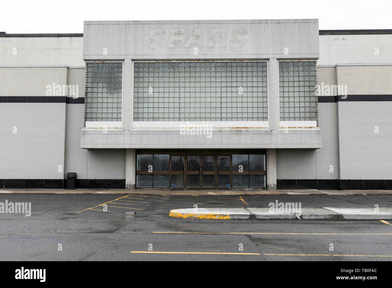 The outline of a logo sign is seen outside of a closed Sears retail ...