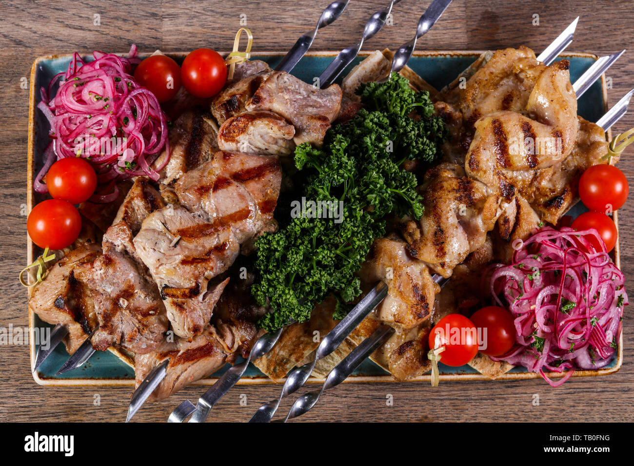 Grilled chicken and pork barbeque Stock Photo - Alamy