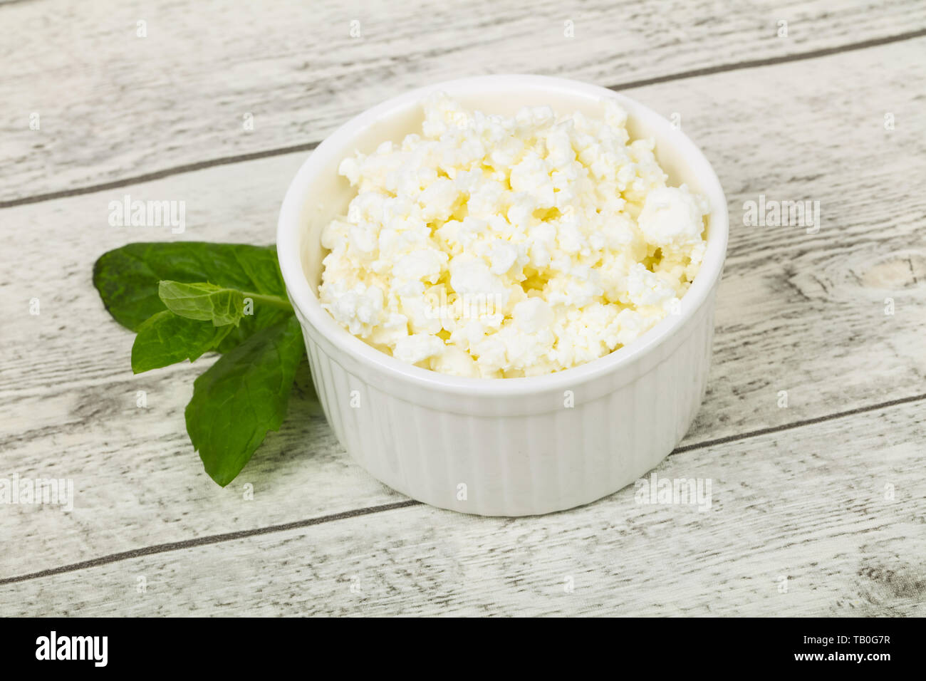 Natural cottage cheese served mint leaves Stock Photo - Alamy
