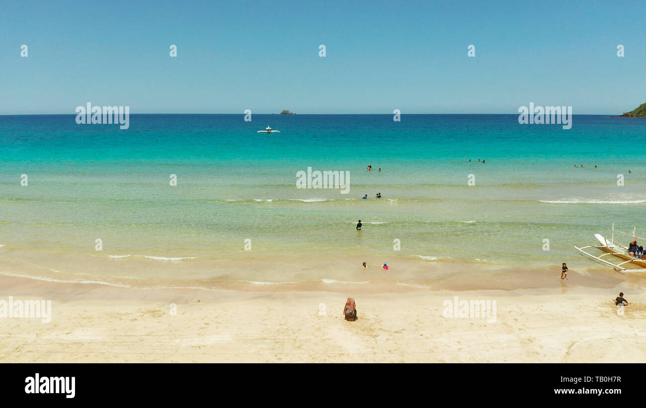 Beautiful tropical beach in cove with blue lagoon and turquoise water ...