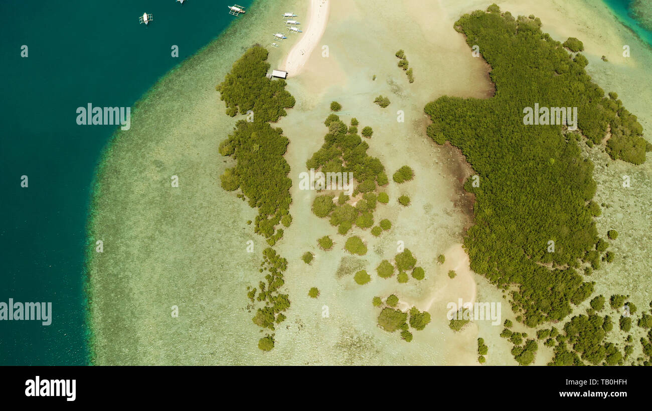 Luli island and sandy beach with tourists, sand bar surrounded by coral ...