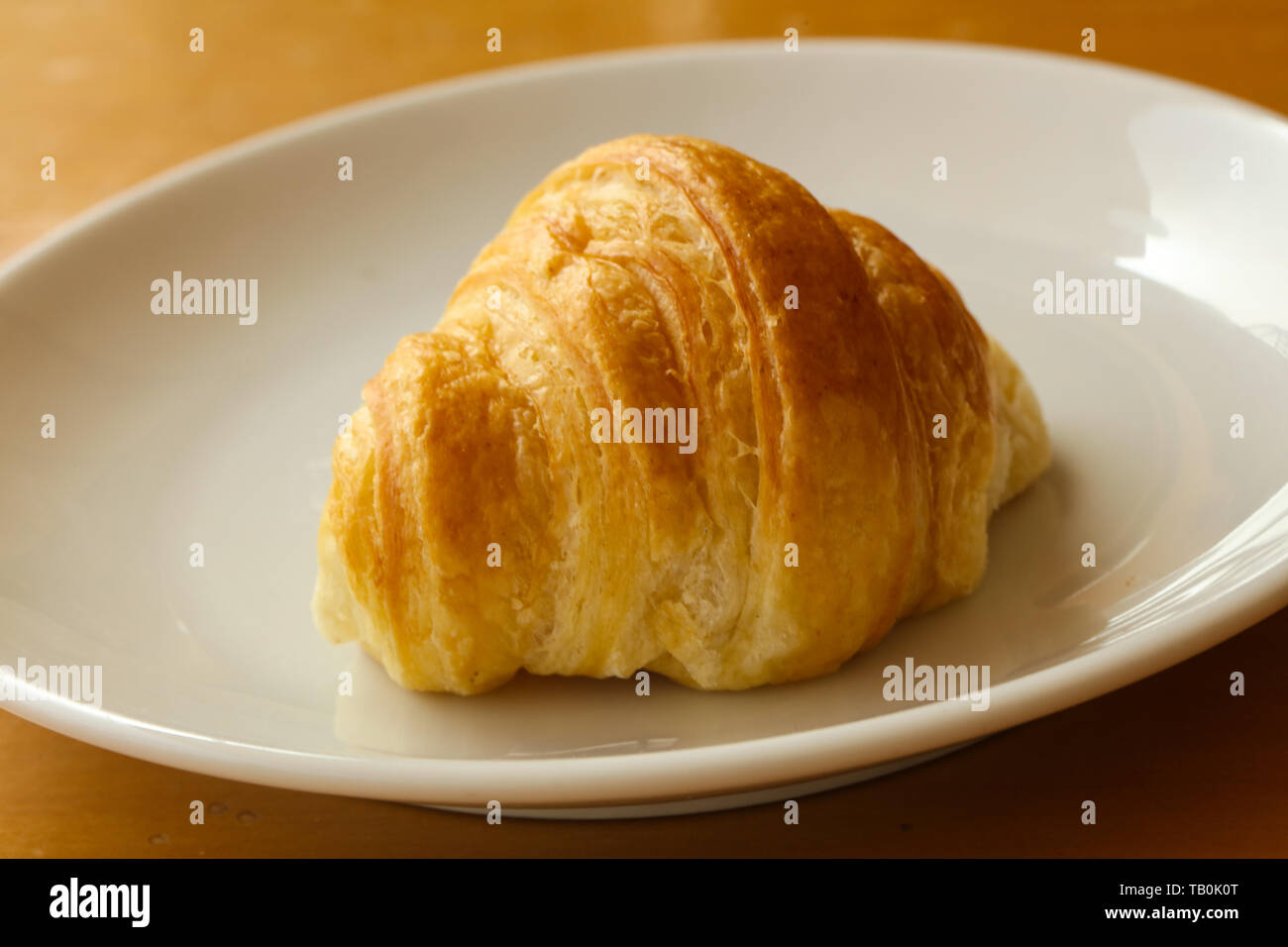 Tasty crust Croissant in the plate Stock Photo - Alamy