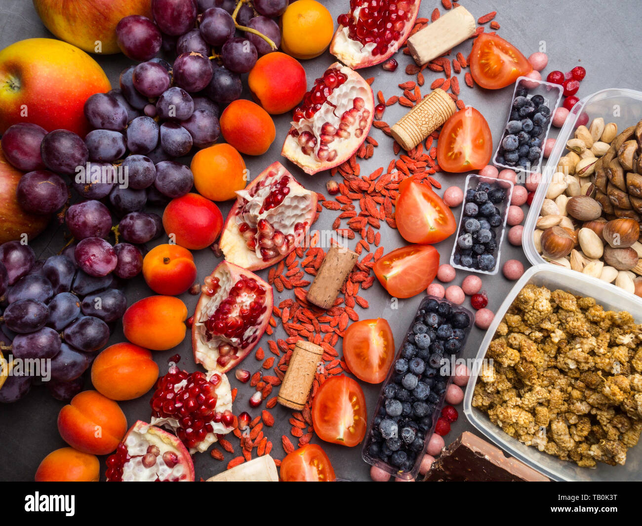 Healthy food clean eating selection: fruits,, superfood, nuts on gray ...